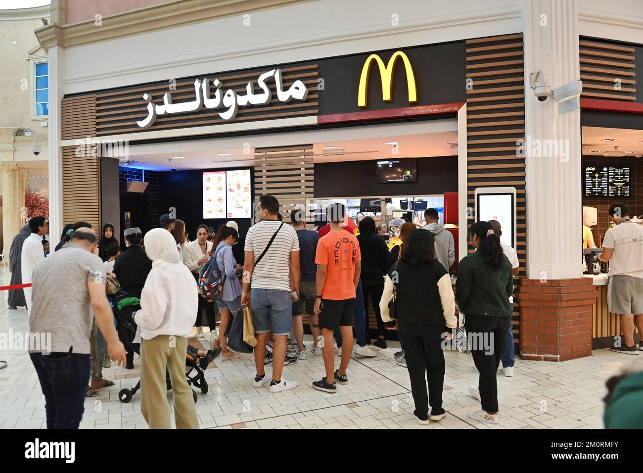 Impressions from Doha/Qatar on December 7th, 2022. Rush in front of a McDonalds fast food chain ...